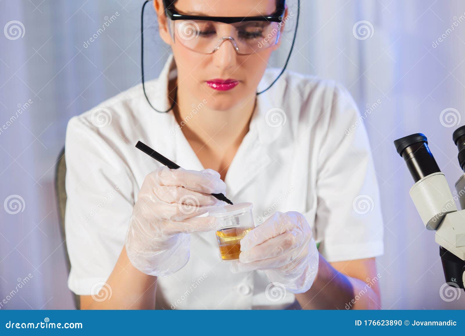 Lab Technician Assistant Analyzing A Blood Sample At Laboratory ...