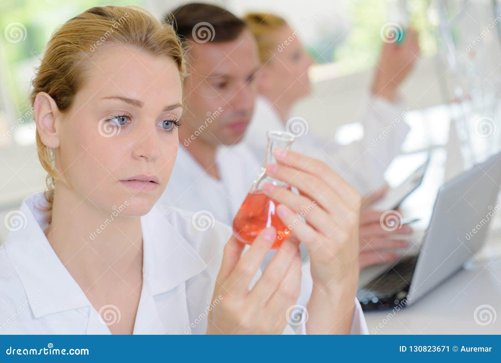 Lab Technician Checking Solutions Stock Image - Image of coat, computer ...