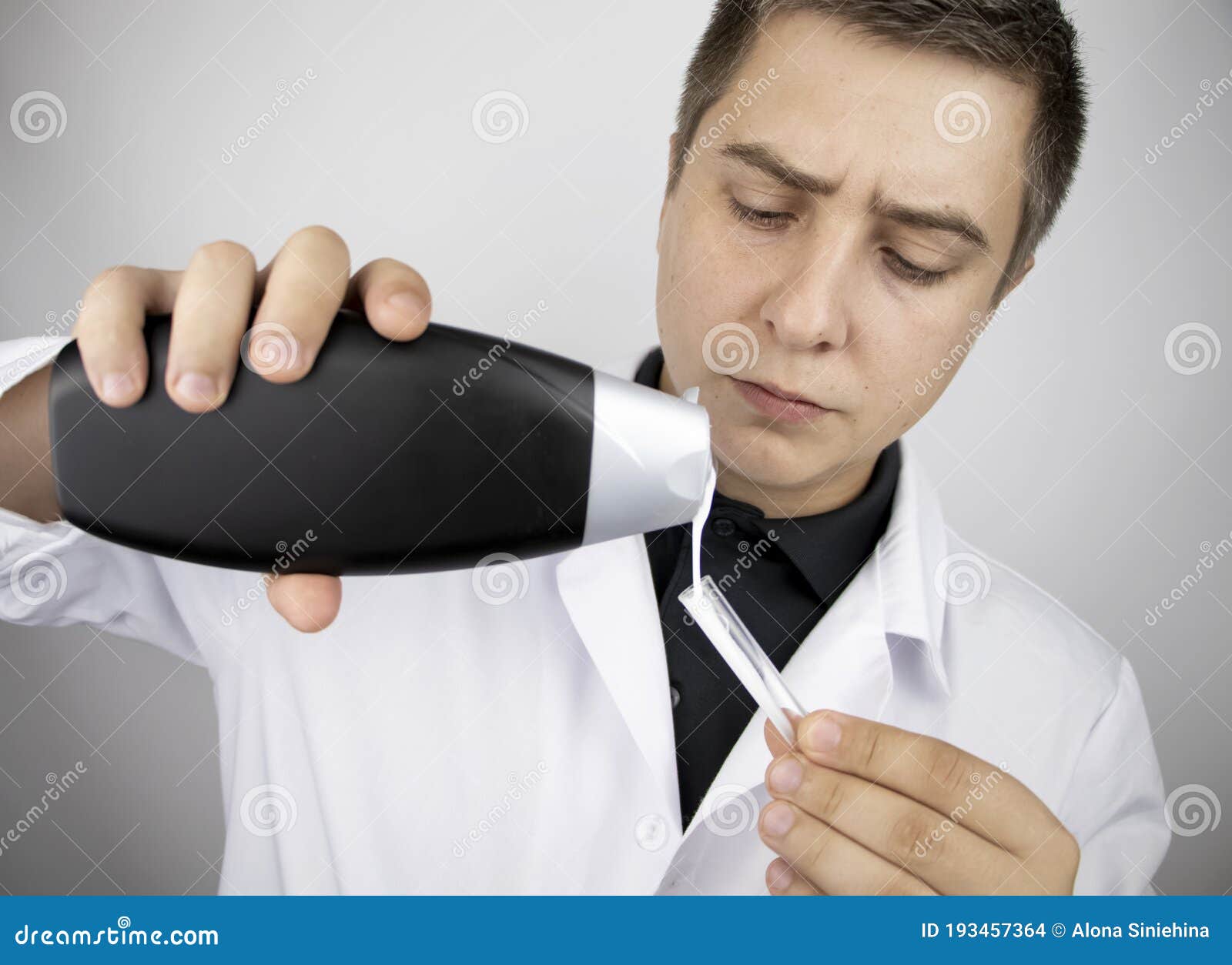 A Lab Technician Examines a Sample of Shampoo he Was Given for Analysis ...