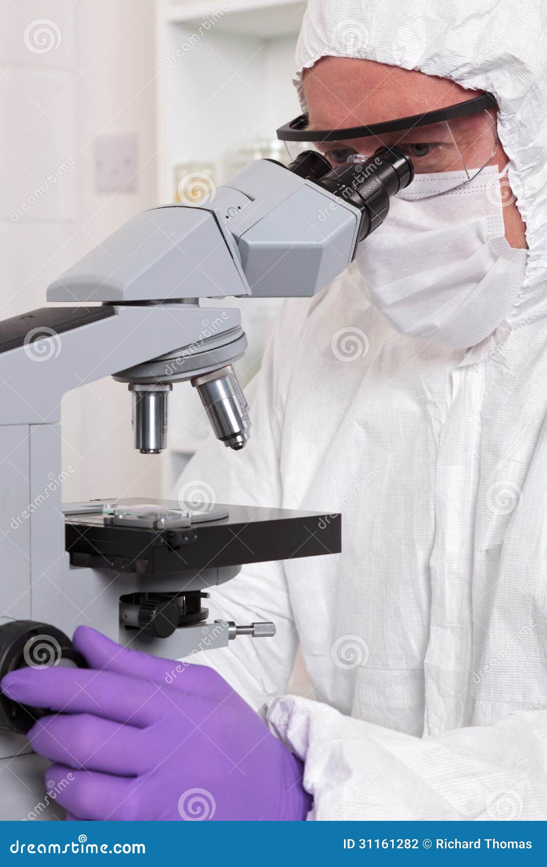 Lab Technician Focussing a Microscope Stock Photo - Image of laboratory ...