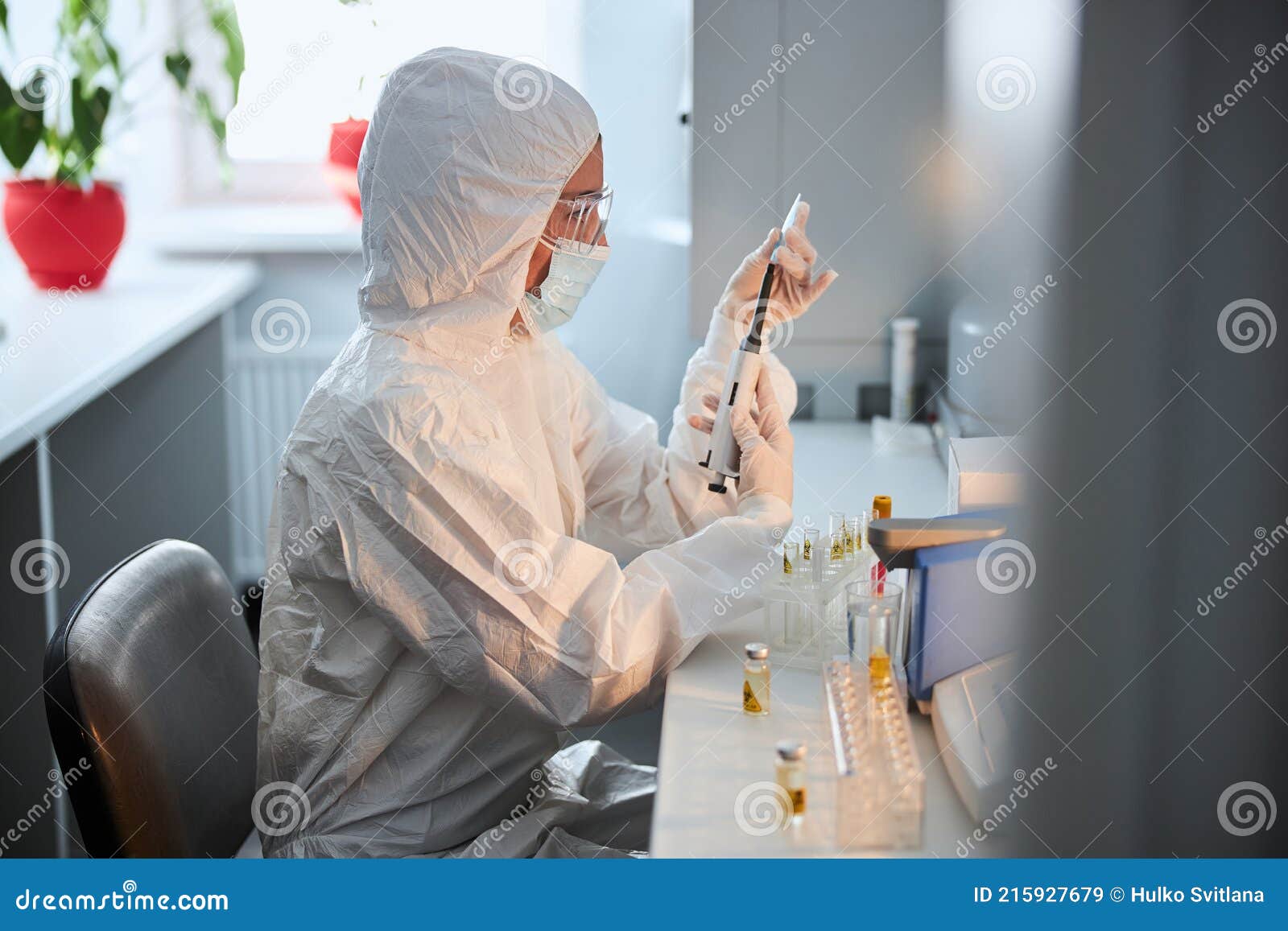 Lab Technician in a Hazmat Suit Getting Ready for Work Stock Image ...