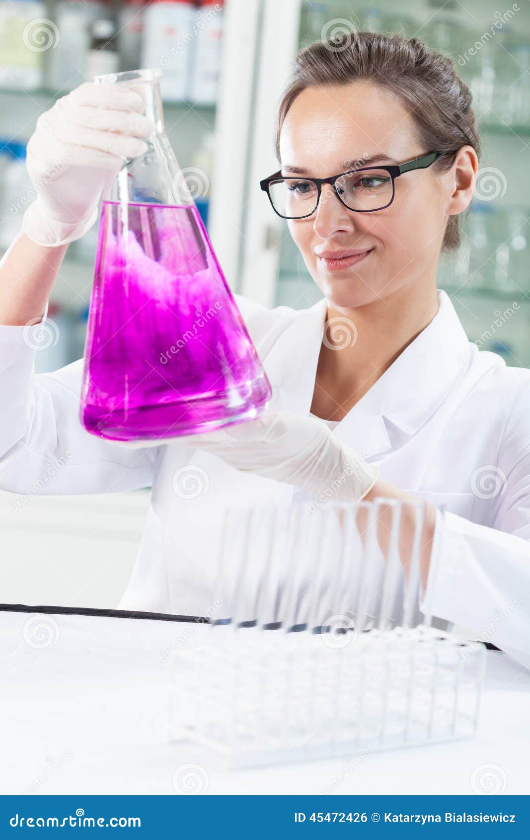 Lab Technician Holding Flask Stock Photo - Image of scientist, looking ...