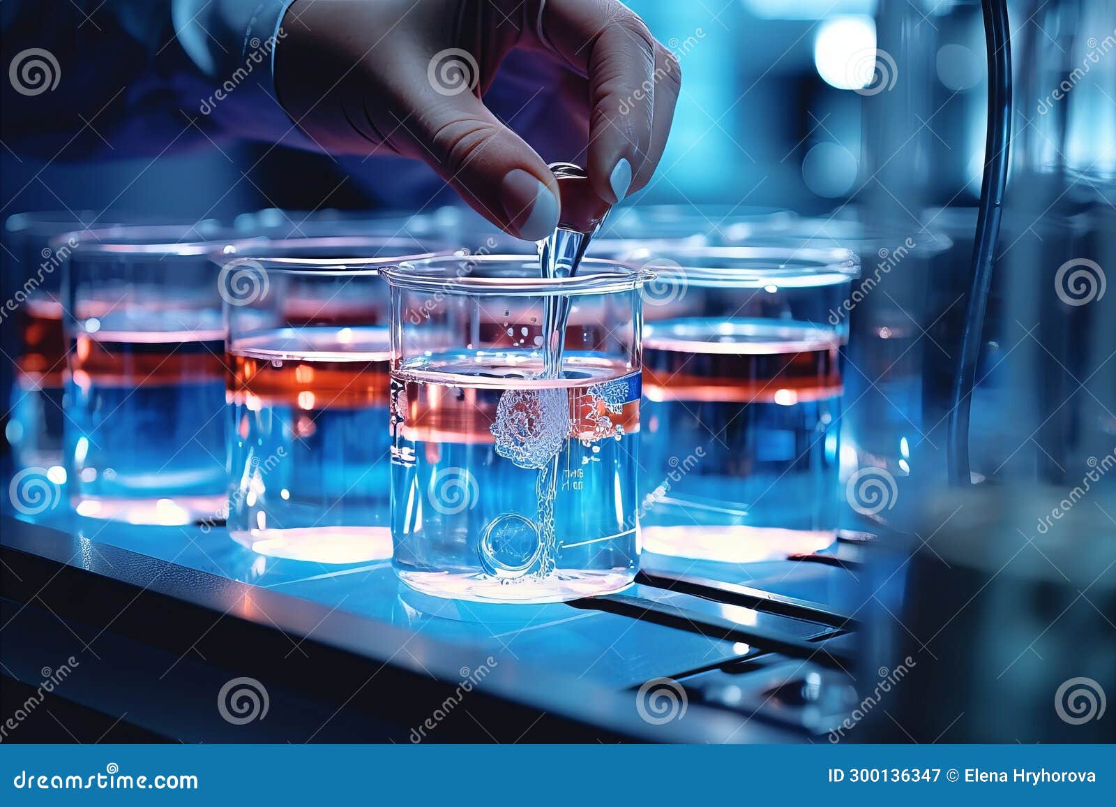 Lab Technician Pipetting Liquid into Test Tubes with Blue Solution ...