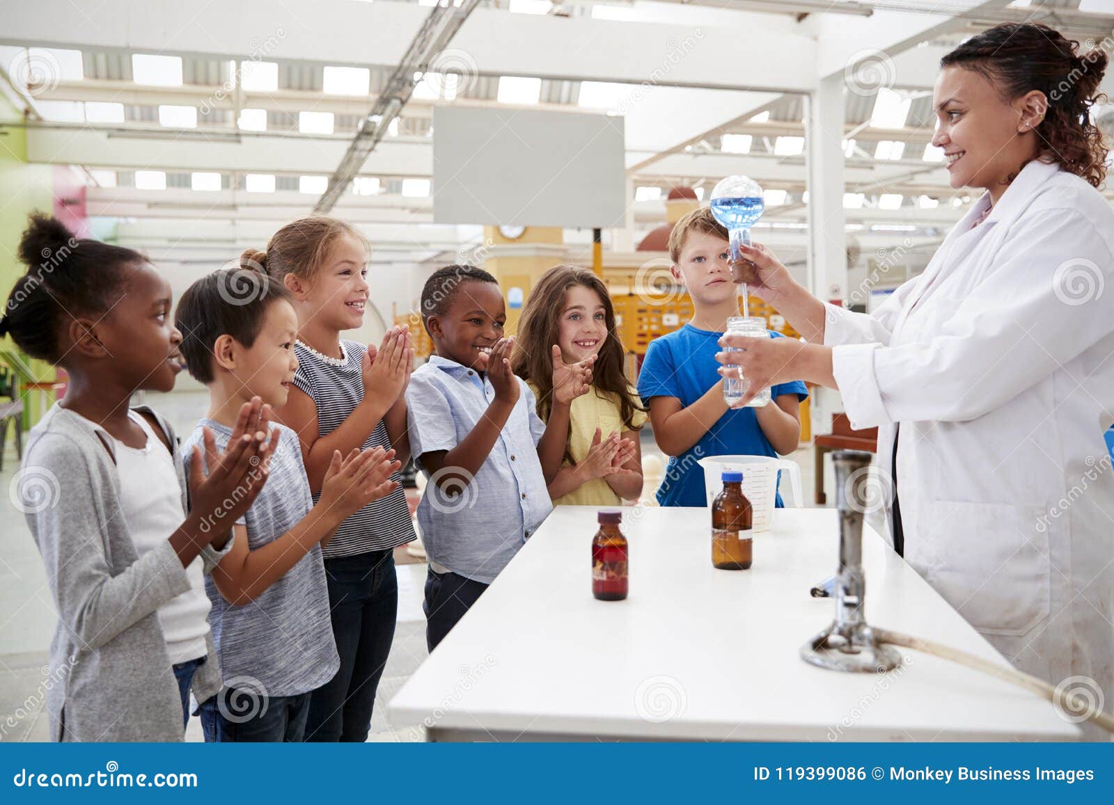 Lab Technician Showing Excited Kids a Science Experiment Stock Photo ...