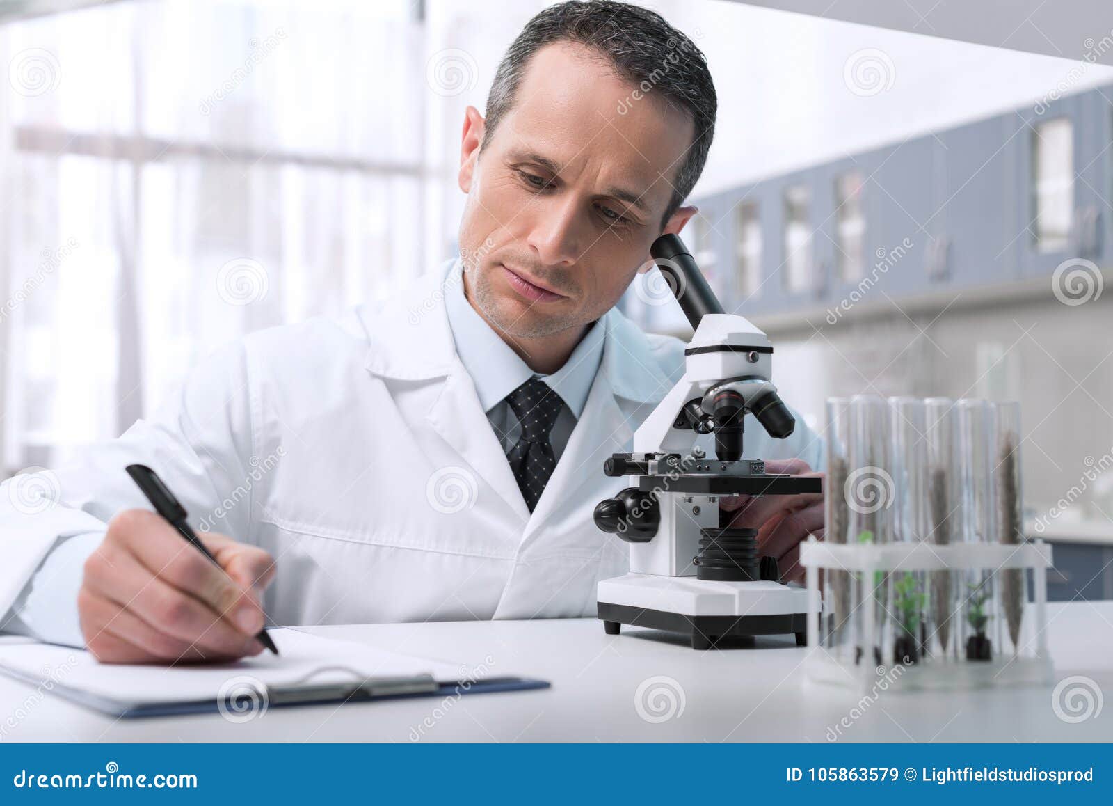 Lab Technician Taking Notes Stock Image - Image of scientist, focused ...