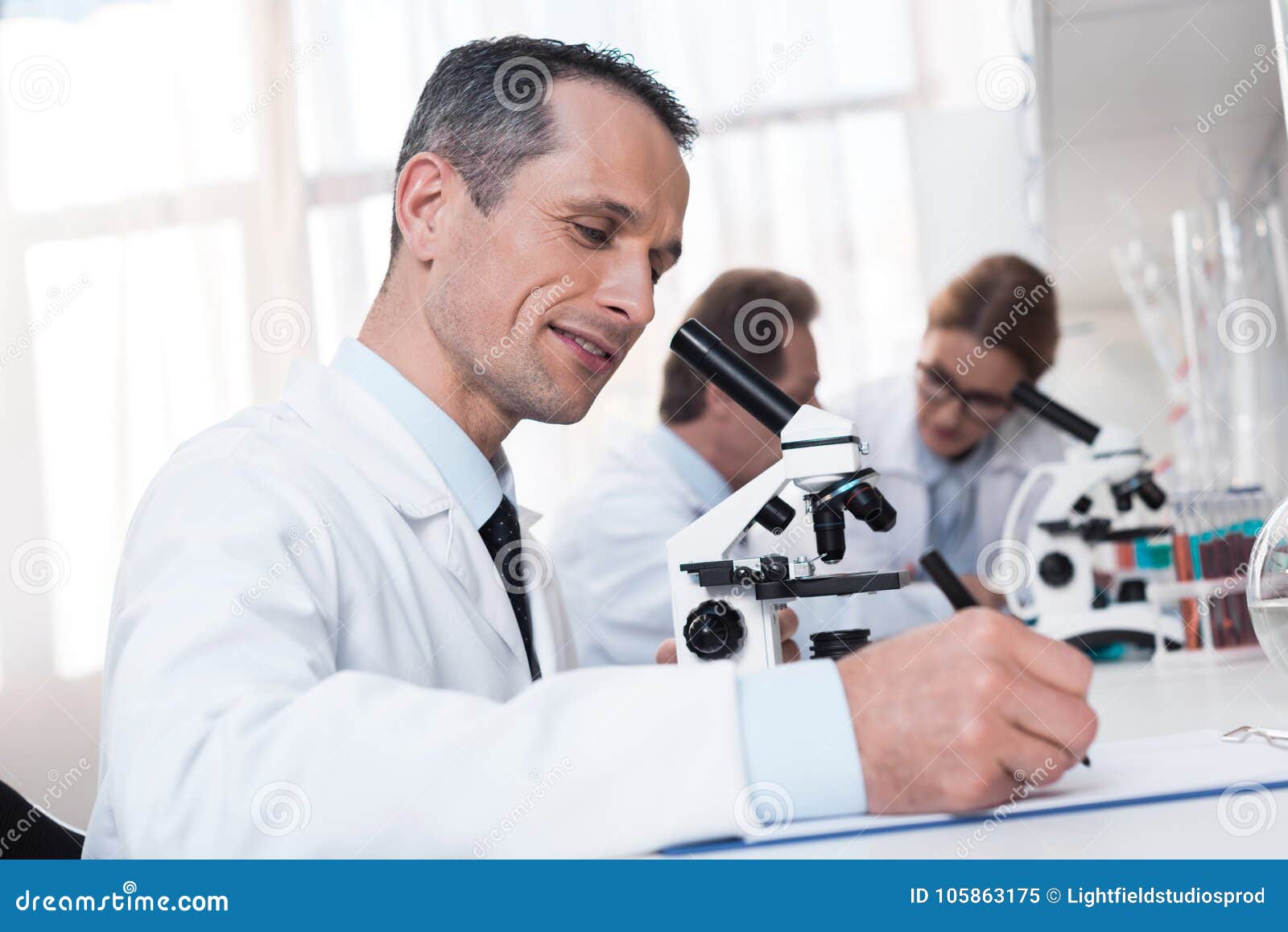 Lab Technician Taking Notes Stock Image - Image of profession ...