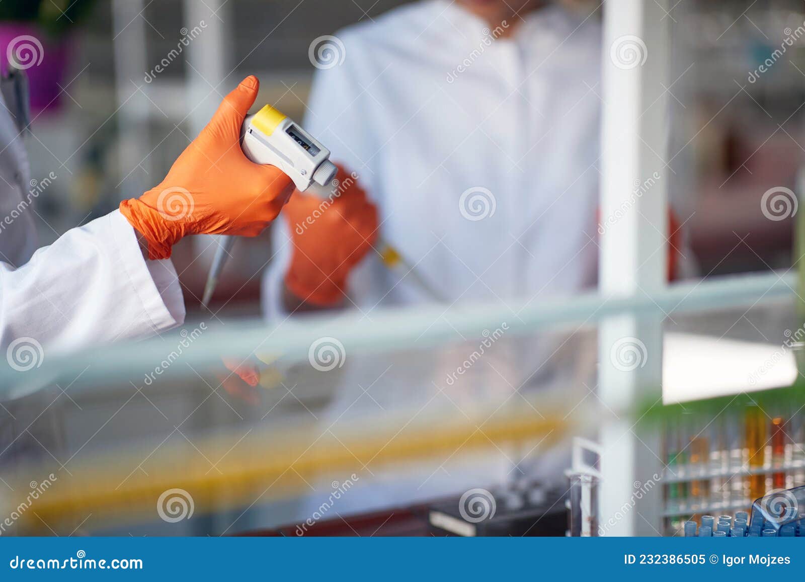 Lab Technicians Filling Test Tubes with Apparatus, Concept Stock Image ...
