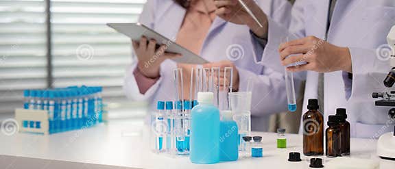 Lab Technicians Handling Specimens and Digital Data for Experiment Documentation Stock Image ...