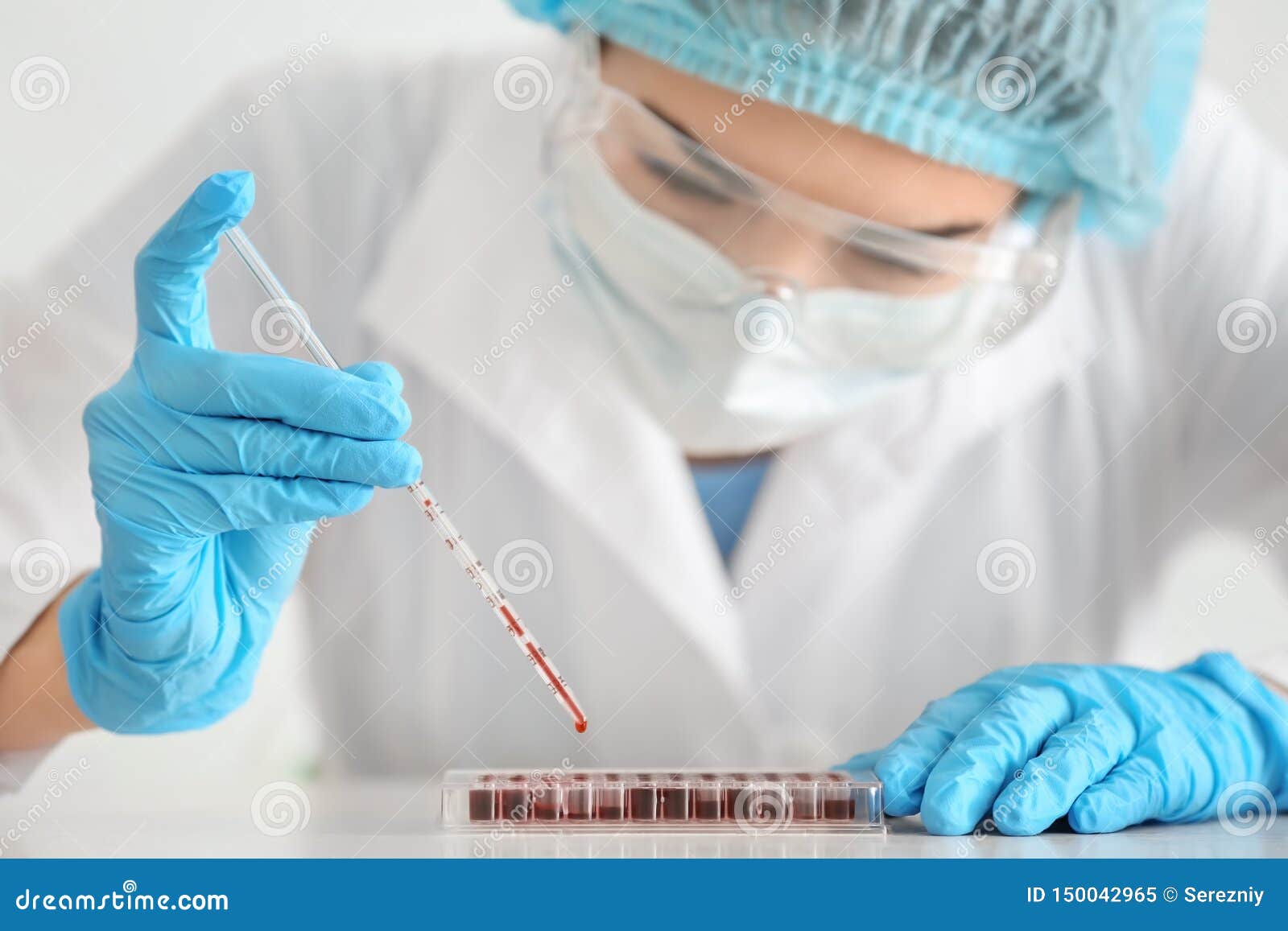 Lab Worker Dripping Blood Samples into Test Tubes at Table Stock Image ...