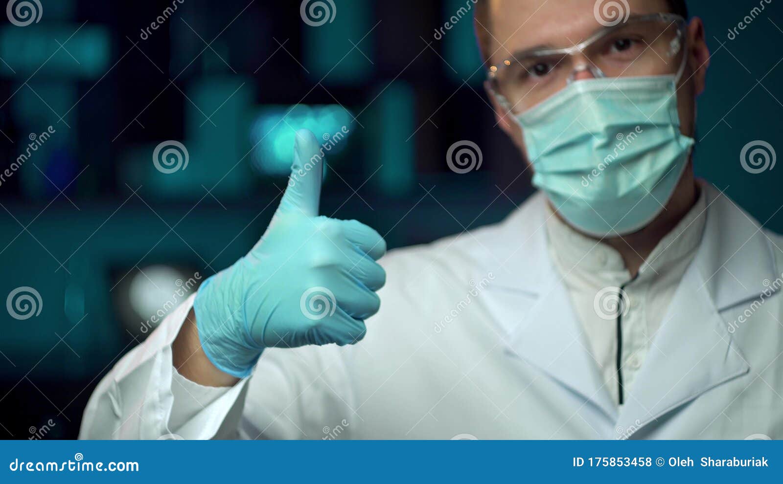 A Lab Worker in a Mask Puts on Protective Work Glasses for Working in ...