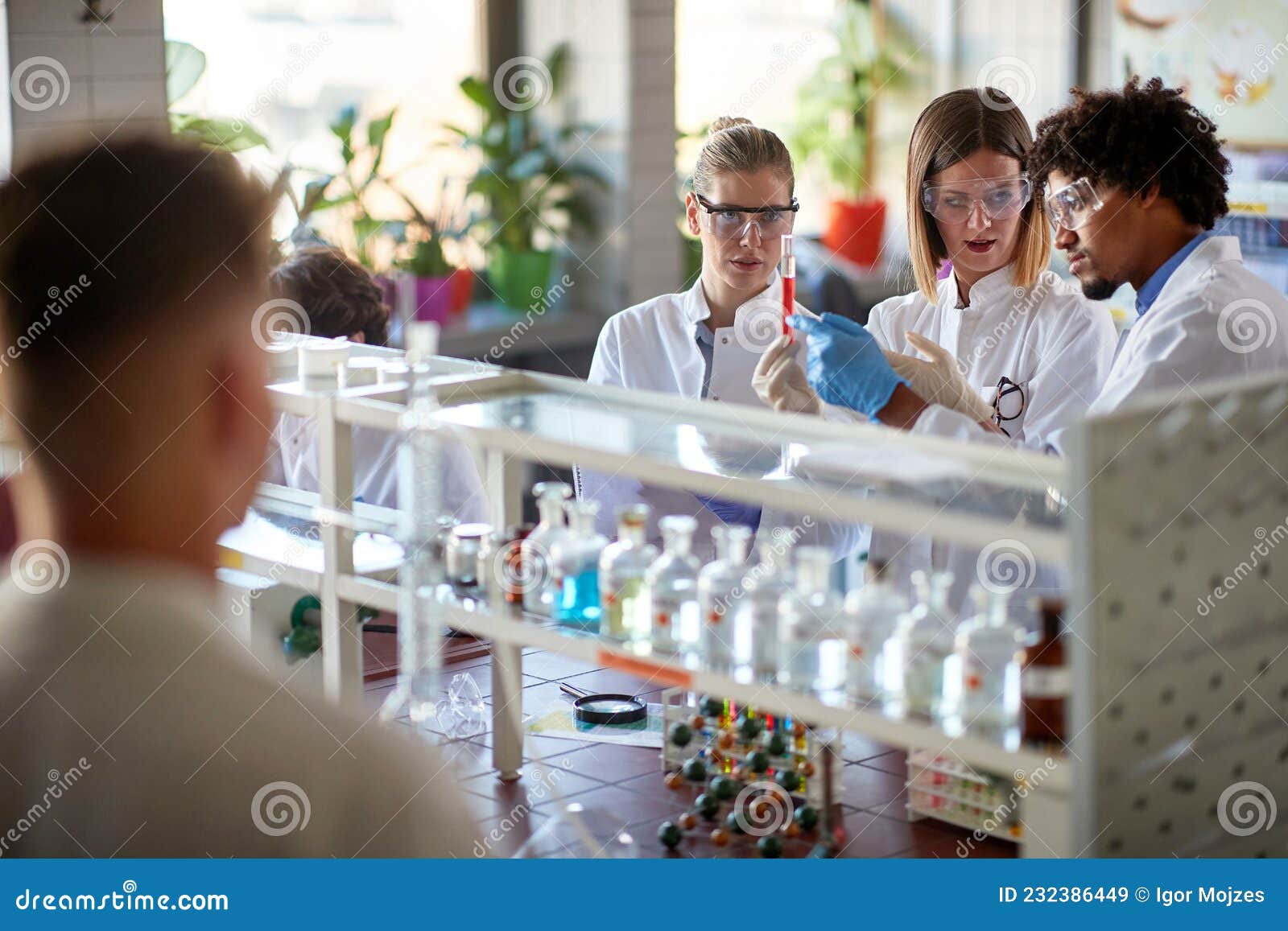 Lab Workers Analyze Contents in Test Tube Stock Image - Image of people ...