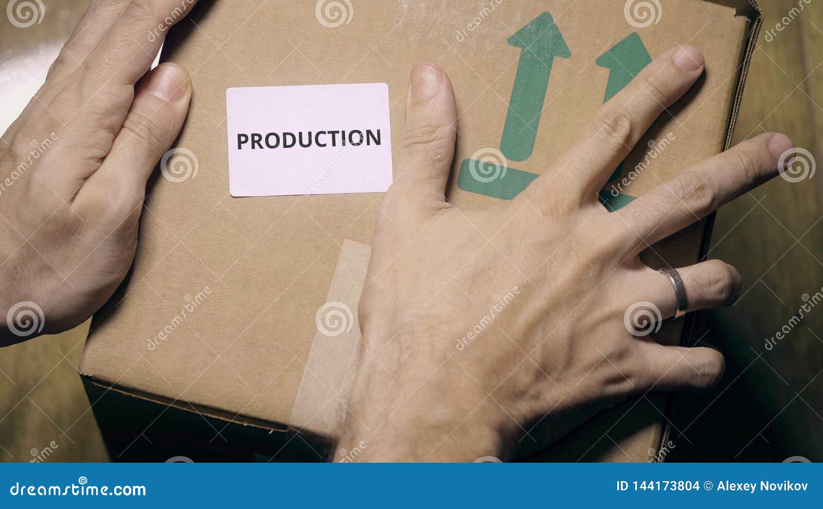 PRODUCTION Sticker on a Carton Stock Photo - Image of employment, hands ...