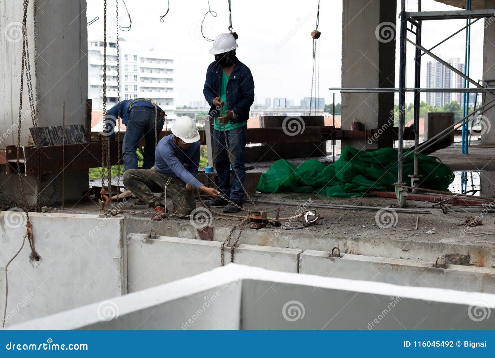 Labor Man Working on Construction Site with Helmet Pulling Concrete ...