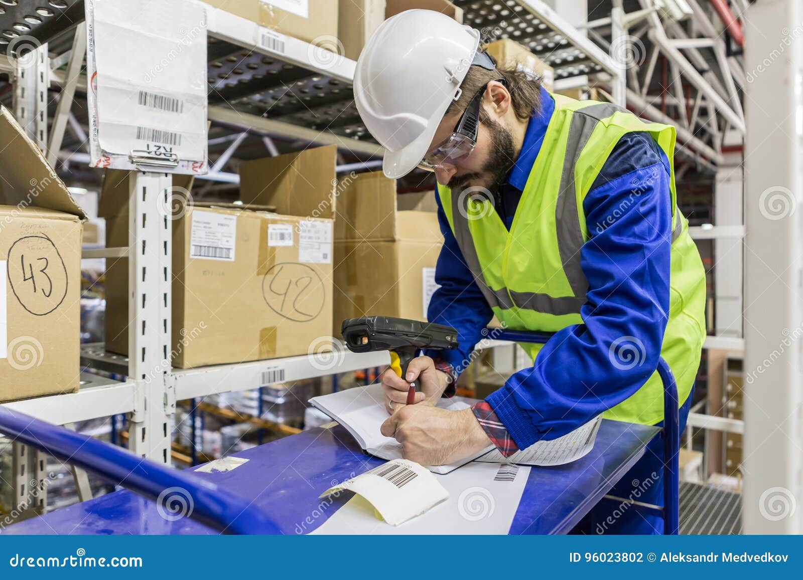 Labor Wearing Uniform and Hard Hat Writing Stock Photo - Image of ...