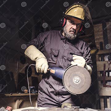 Man with grinder in action stock image. Image of protection - 130210669