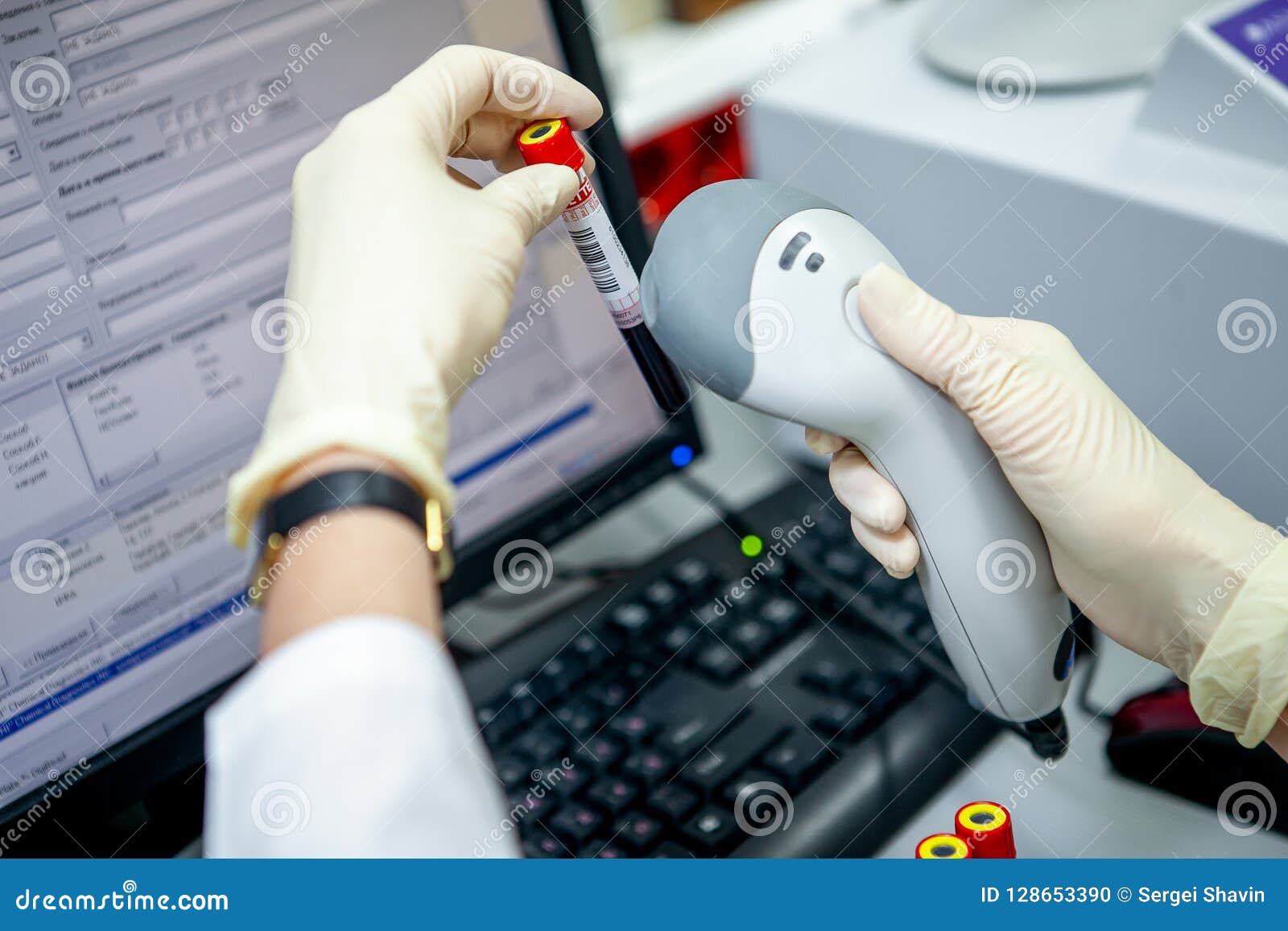 The Laboratory Assistant Holds the Sample in His Hand and Enters the ...