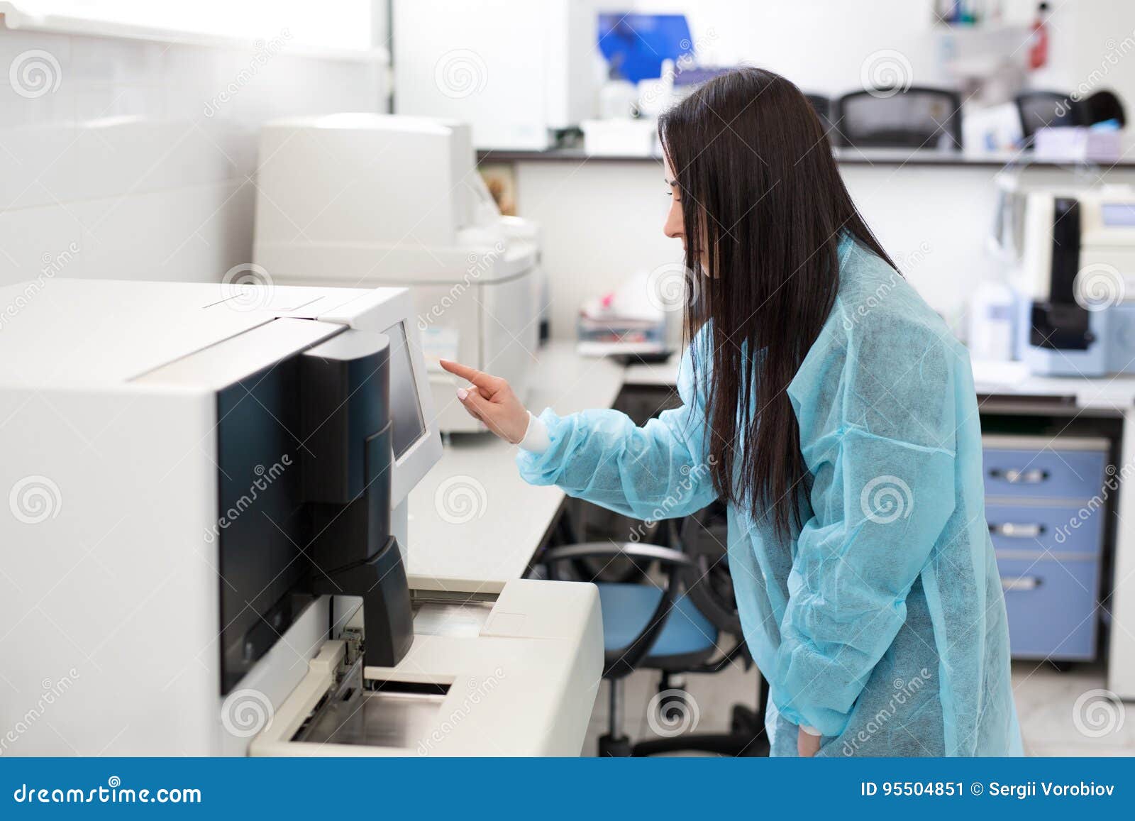 Laboratory Assistant Loading Sample Tubes for Coagulation Test Analysis ...