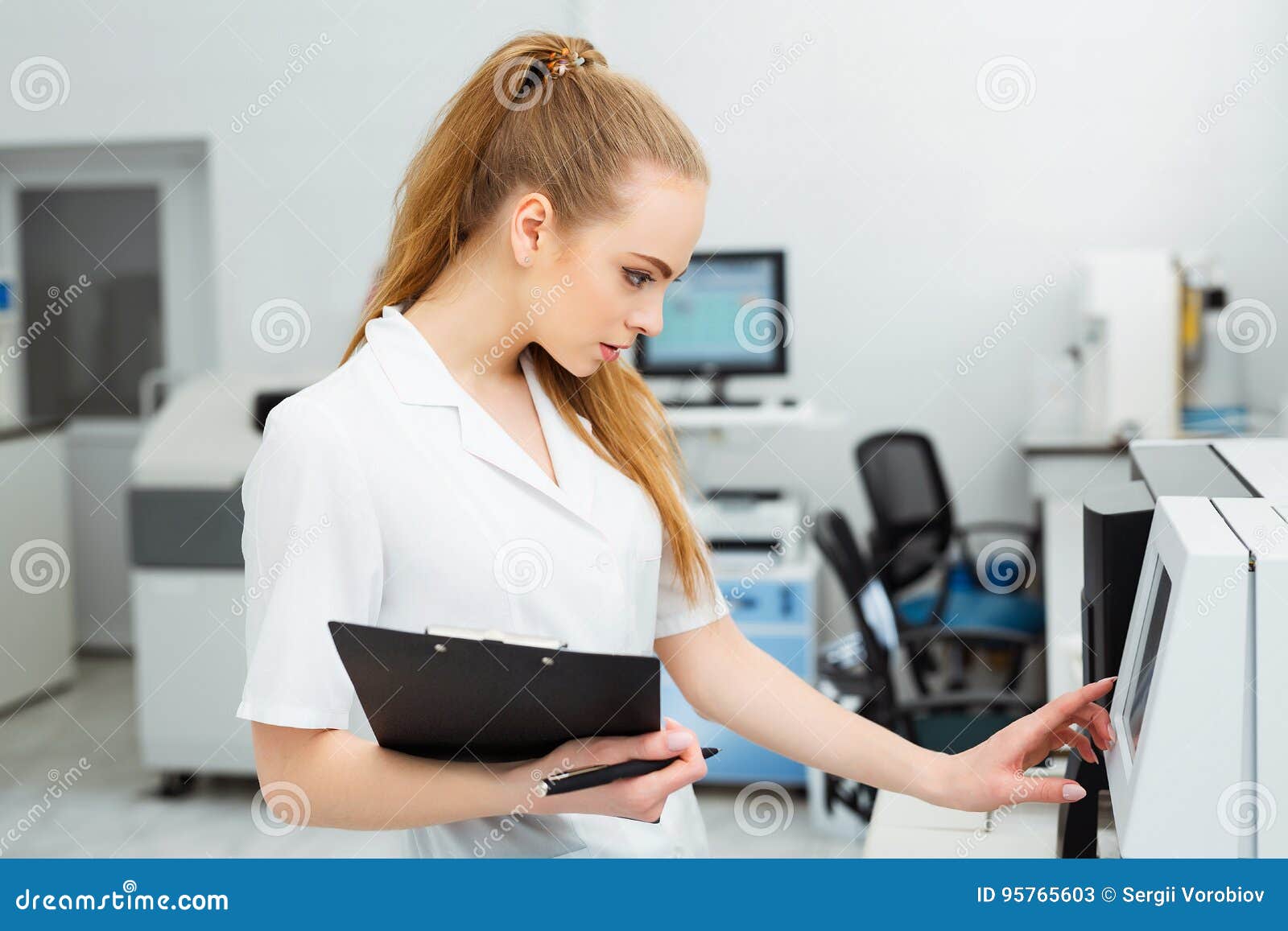 Laboratory Assistant Loading Sample Tubes For Coagulation Test Analysis ...