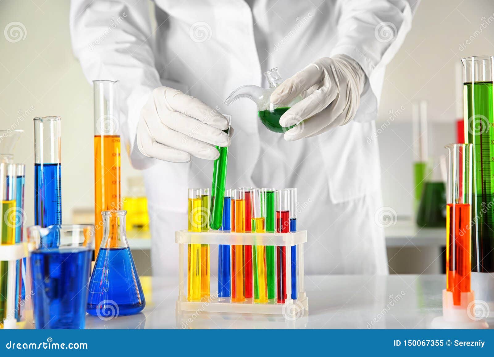 Laboratory Assistant Pouring Liquid into Test Tube Over Table Stock ...