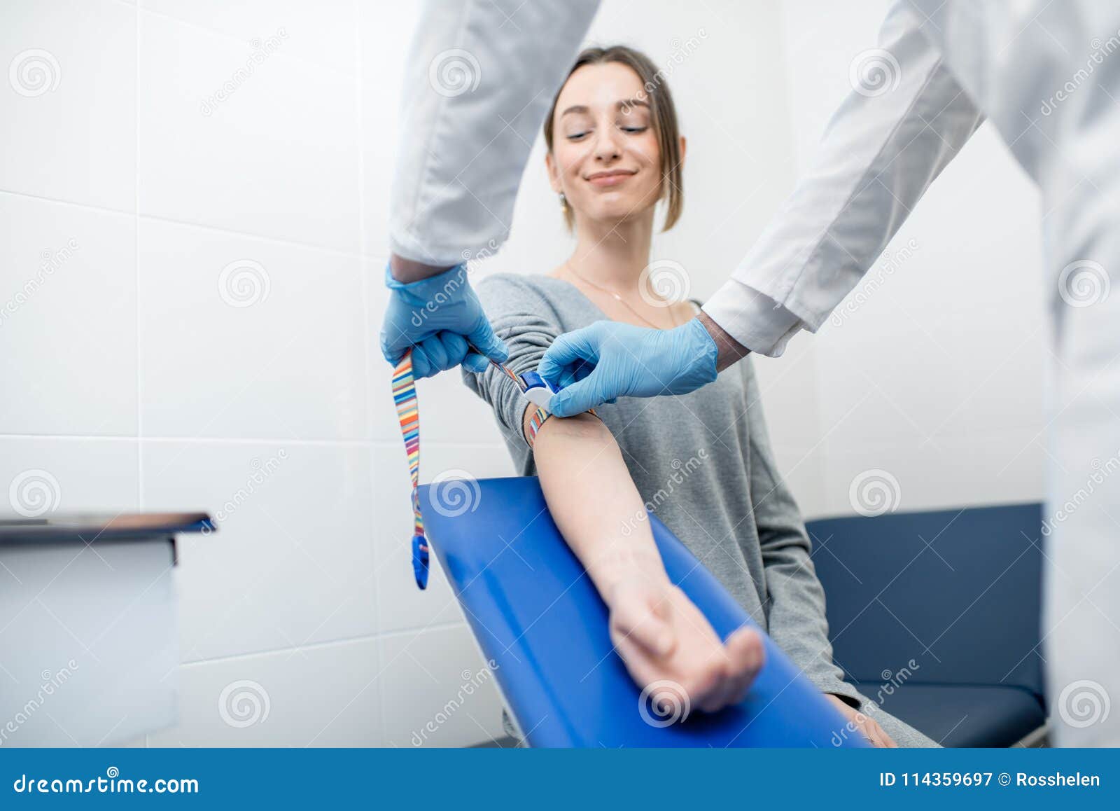 Tightening the Harness on the Arm for Blood Extraction Stock Image ...