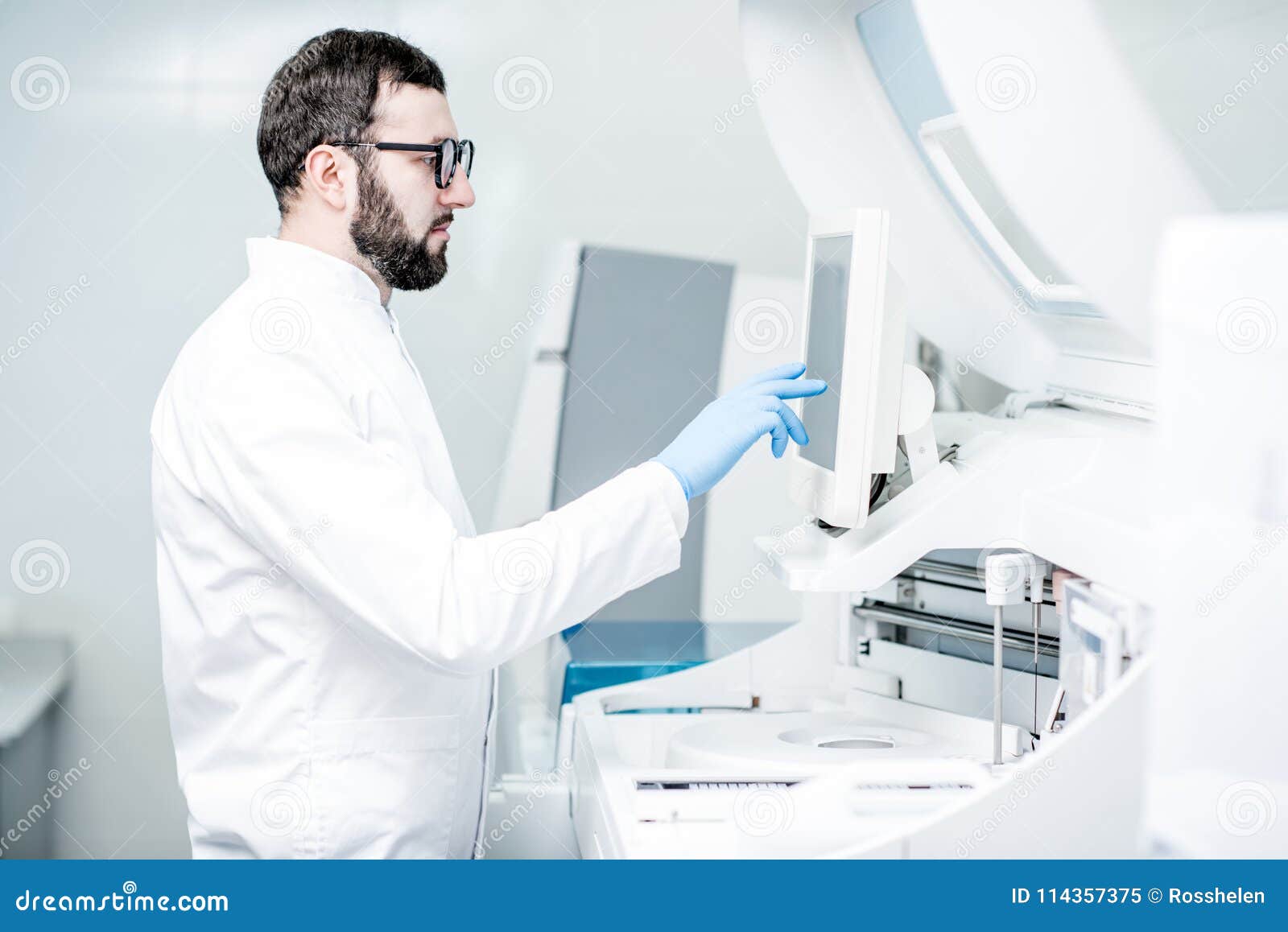 Laboratory Assistant Working with Medical Analizer Machine Stock Image ...