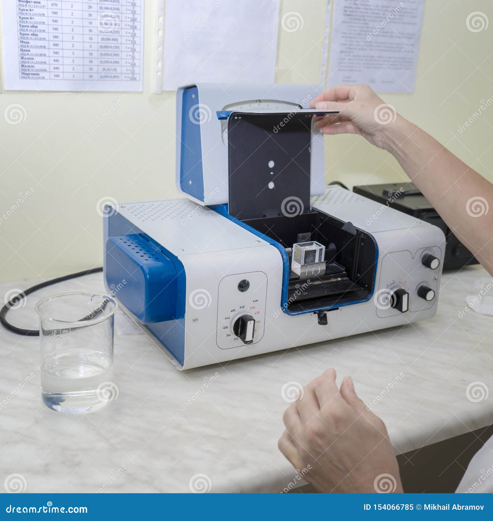 Laboratory Assistant Working Prepare Instrument for Chemical Lab ...