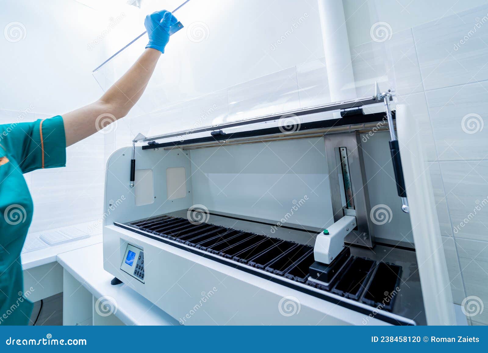 Laboratory Assistant Works with Automatic Multi Slides Stainer at the ...