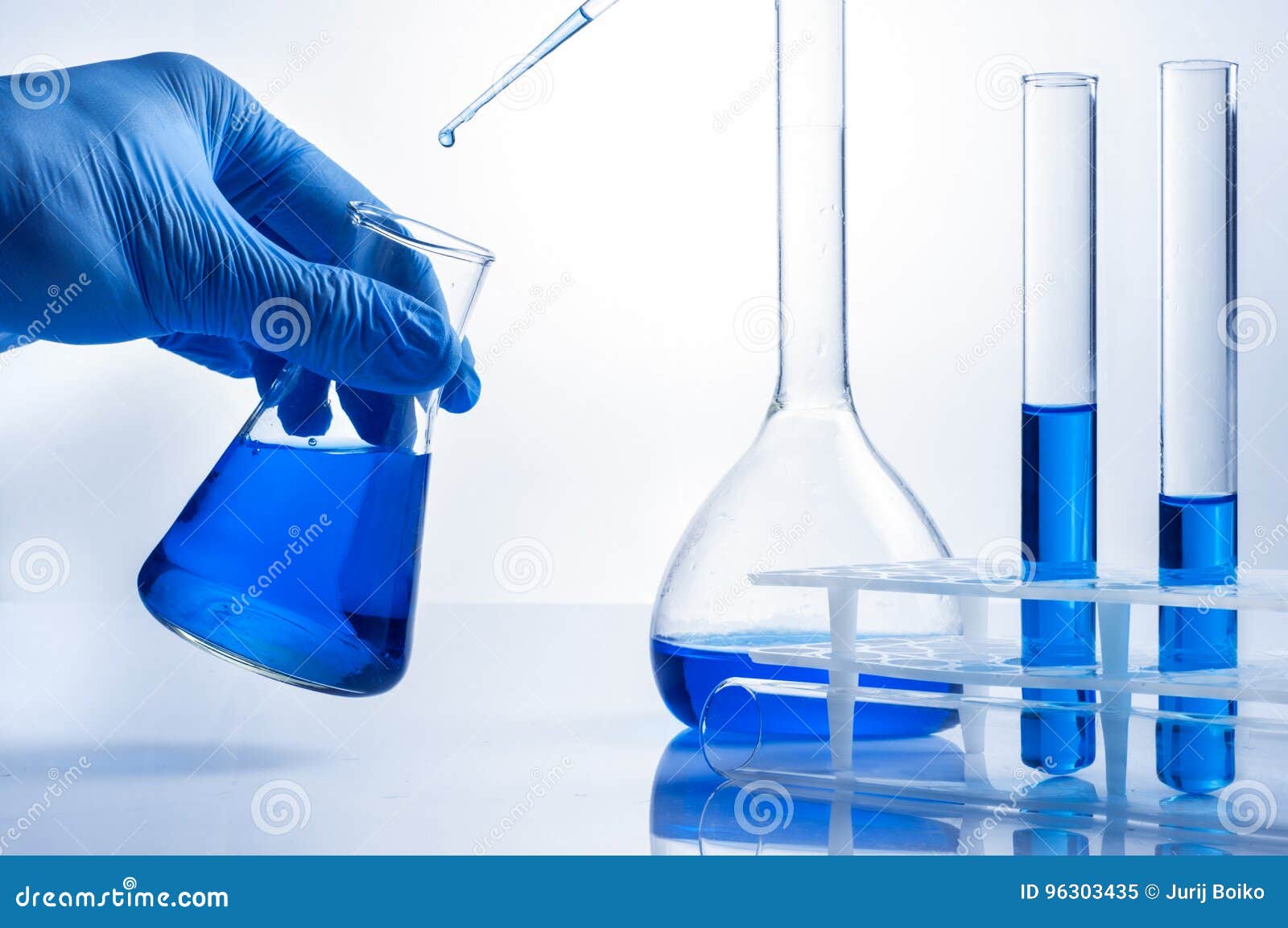 Laboratory Beaker in Analyst& X27;s Hand in Plastic Glove. Stock Image ...