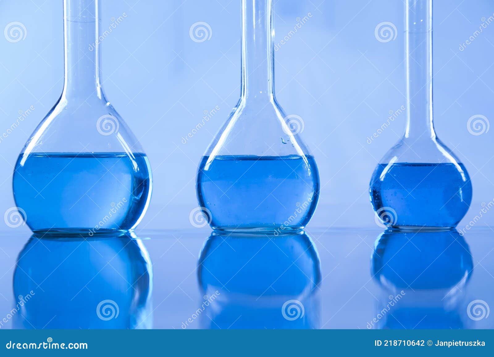 Laboratory Beakers,Science Experiment, Blue Background Stock Photo ...