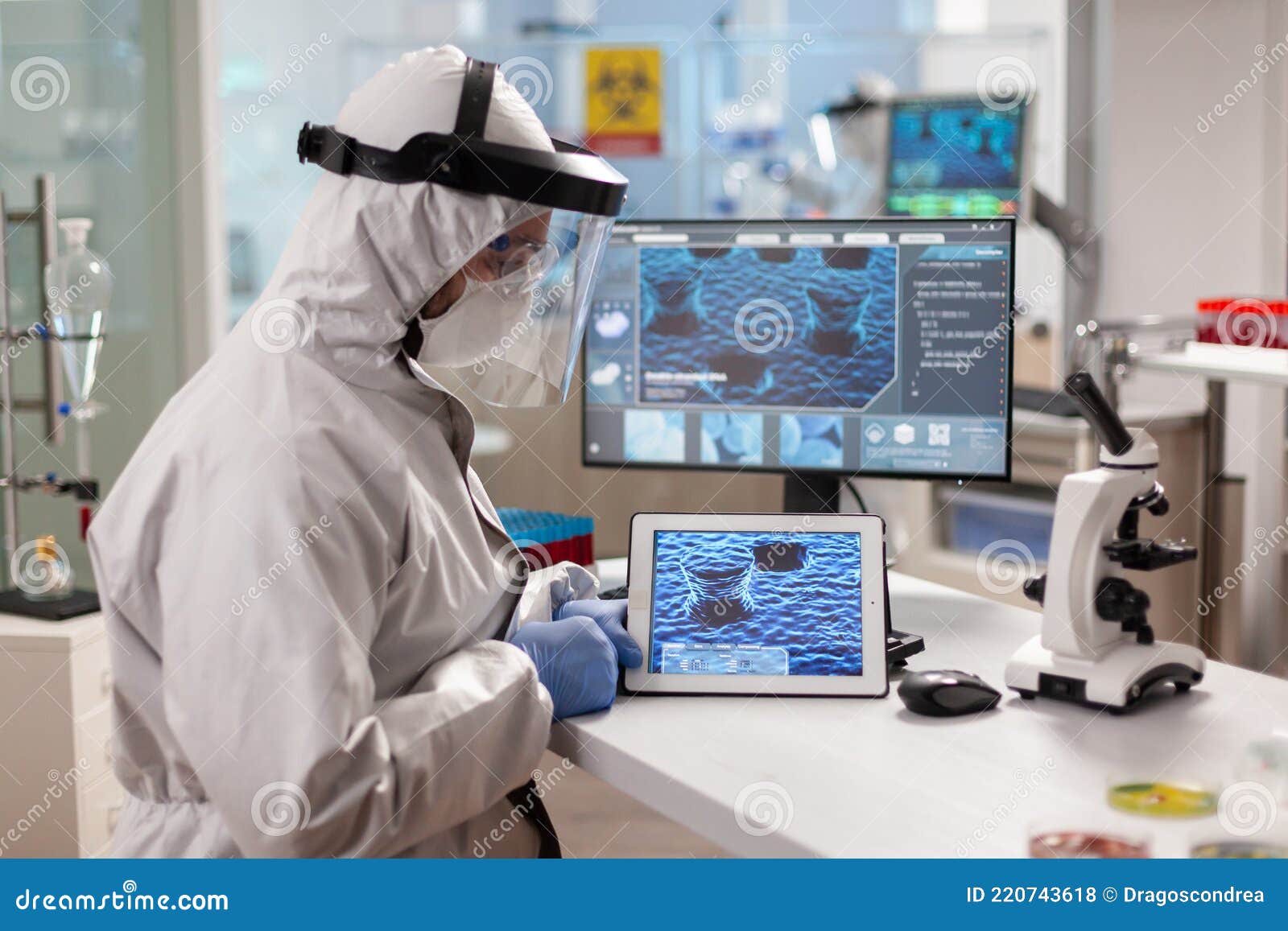 Chemist In Ppe Suit Typing On Computer Checking Virus Development Stock ...