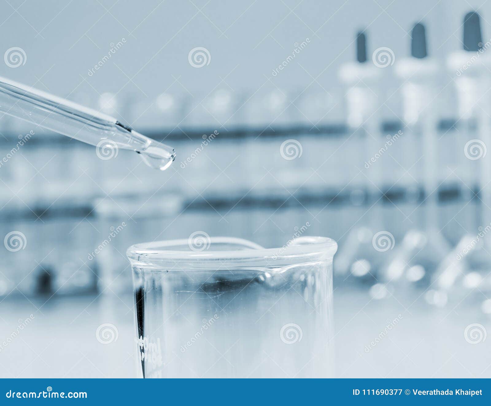 Laboratory Closeup of Droper with Beaker on Science Glassware ...