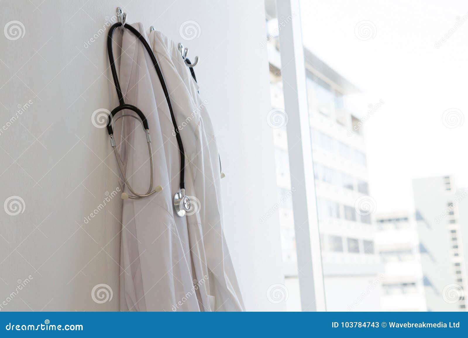 Laboratory Coat and Stethoscope Hanging on Hook Stock Image - Image of ...