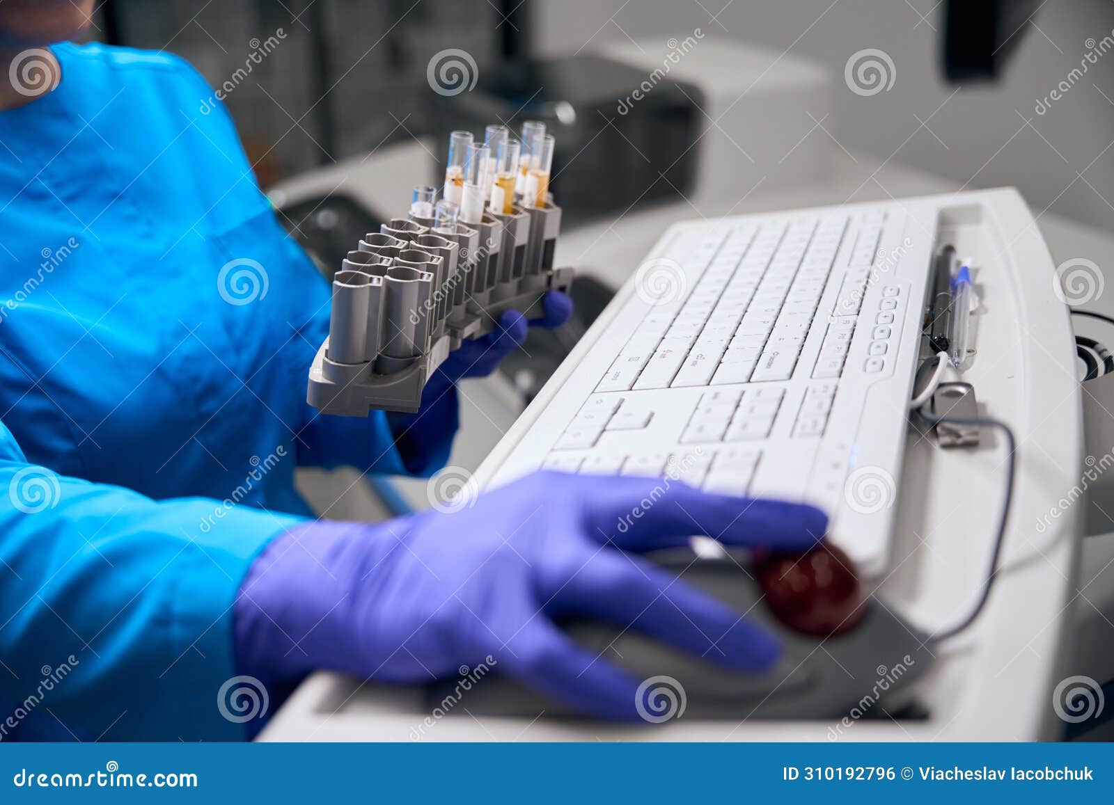 Laboratory Employee Uses Modern Equipment To Analyze Biomaterial Stock ...