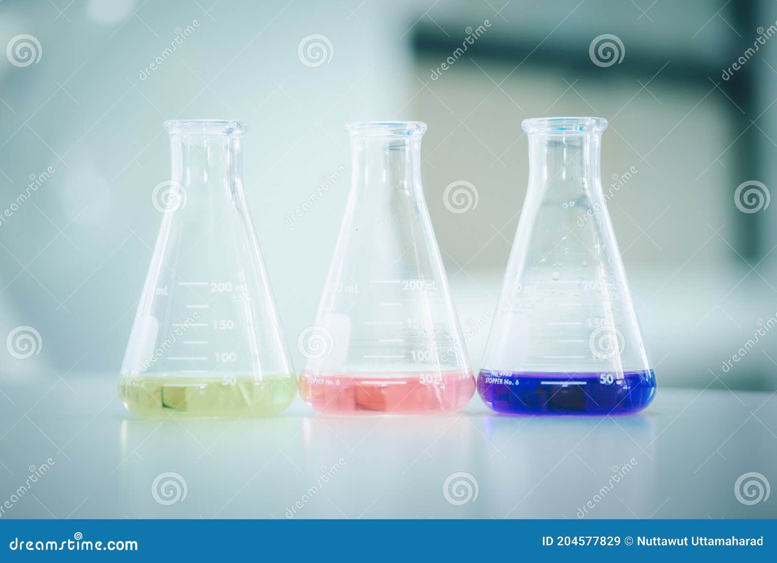 Laboratory Flask with Colorful Liquids Stirred Inside in Laboratory ...