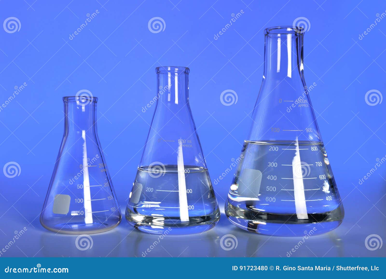 Laboratory Flasks Over Blue Background Stock Photo - Image of science ...