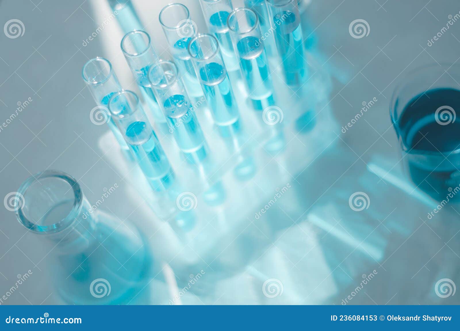 Laboratory Flasks and Test Tubes on the Table in the Rays of Sunlight ...