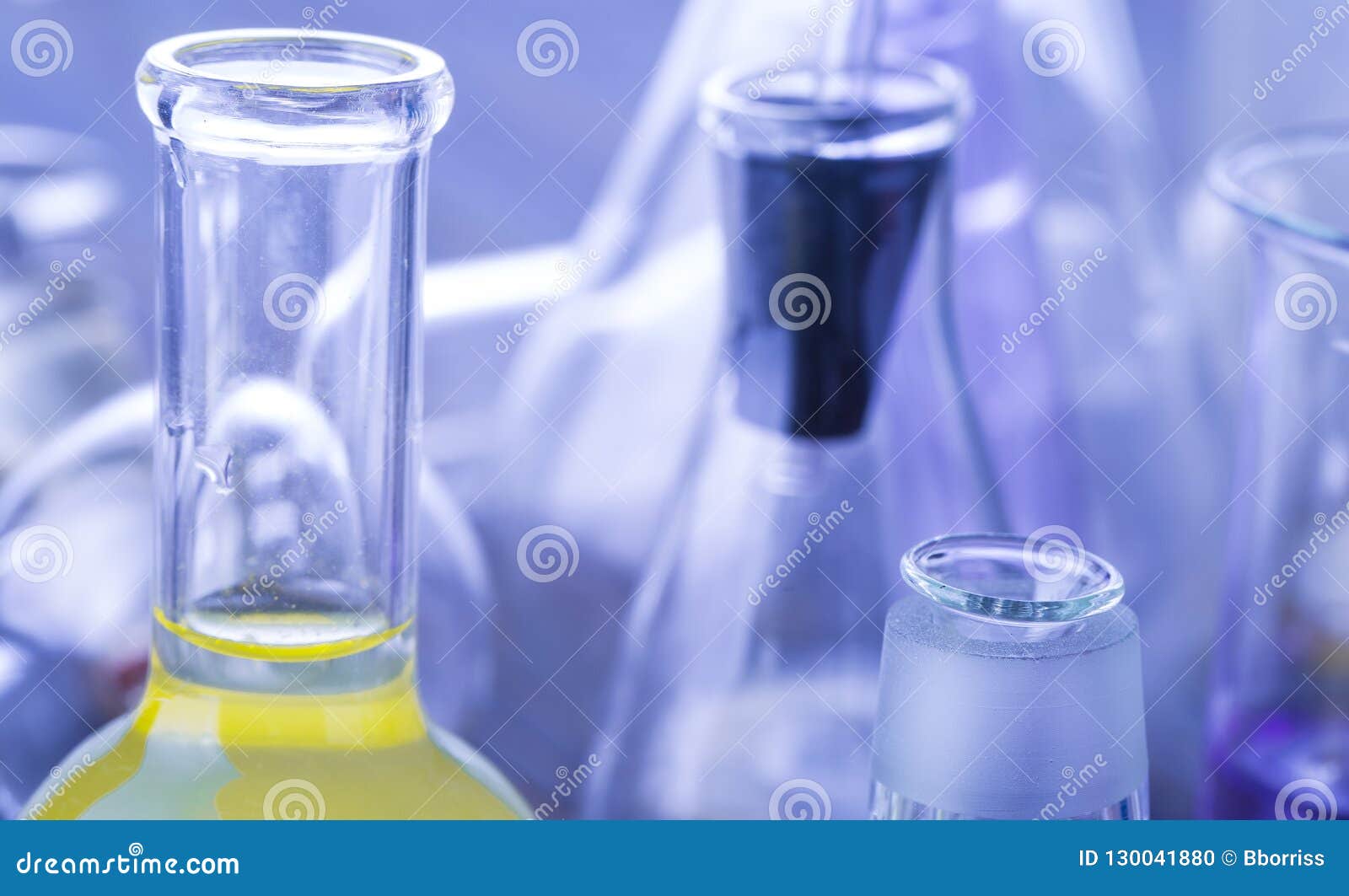 Laboratory Glassware on Blue Background. Stock Photo - Image of fluid ...