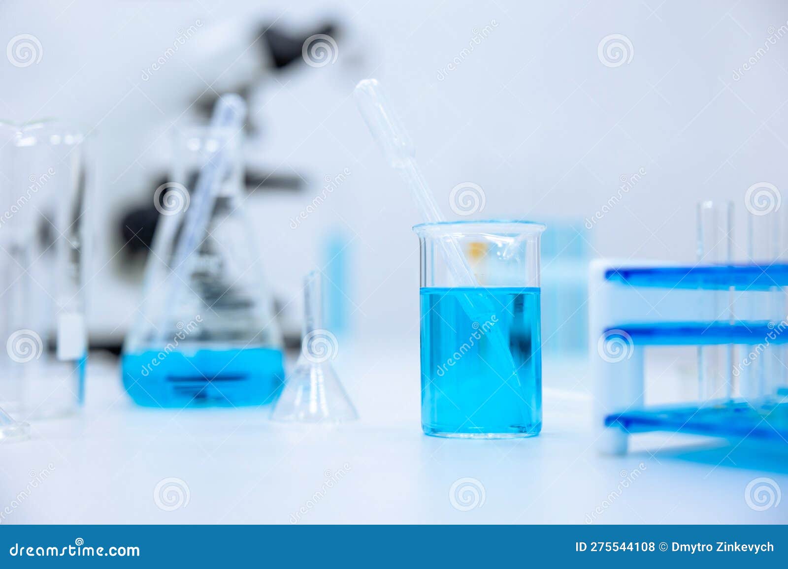 Laboratory Glassware with Color Liquid and Microscope, Microbiologist ...