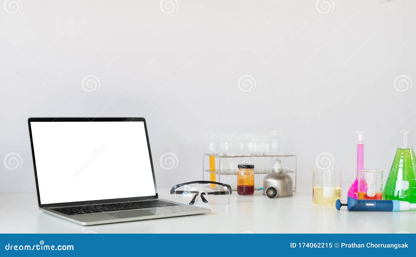 Laboratory Glassware Containing Colored Liquids, Computer Laptop with ...