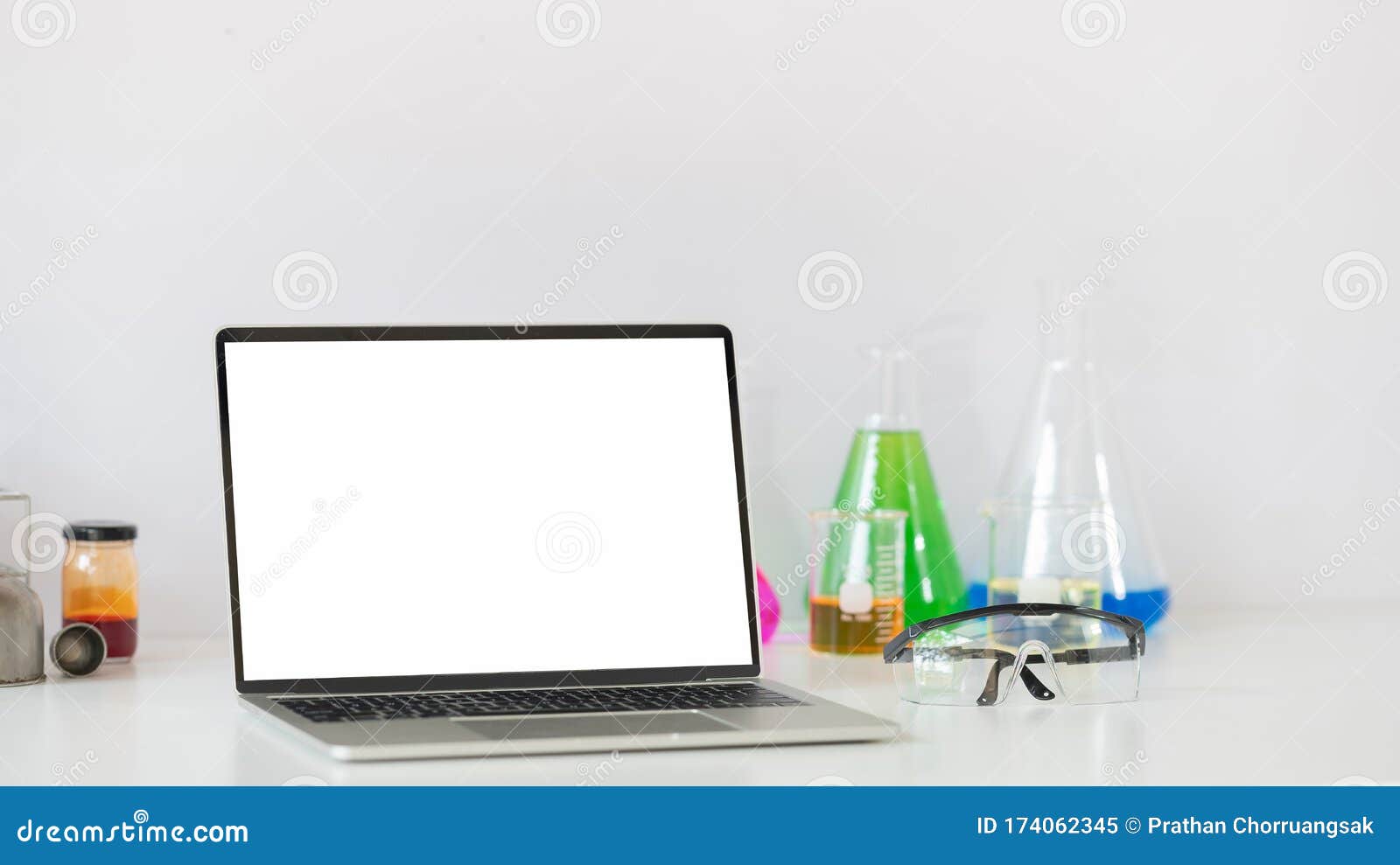 Laboratory Glassware Containing Colored Liquids, Computer Laptop with ...