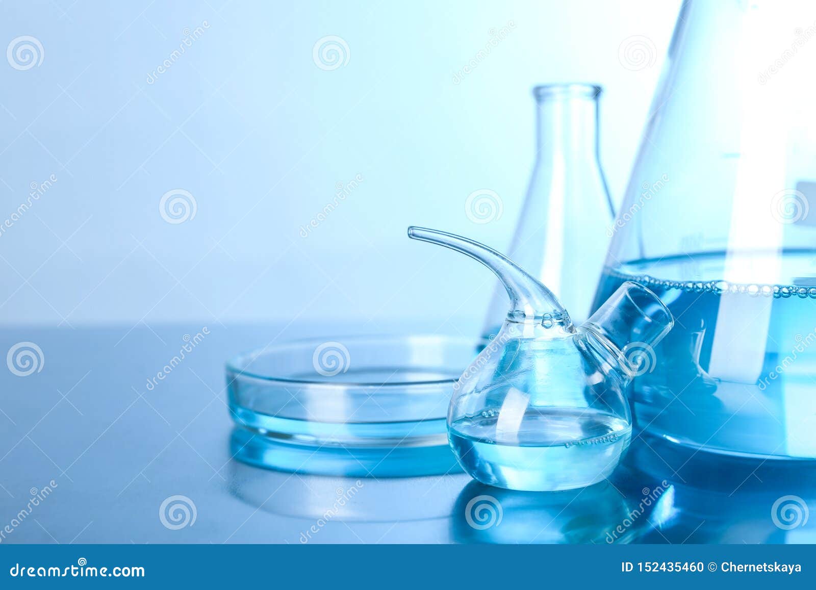 Laboratory Glassware with Liquid on Table. Solution Chemistry Stock ...
