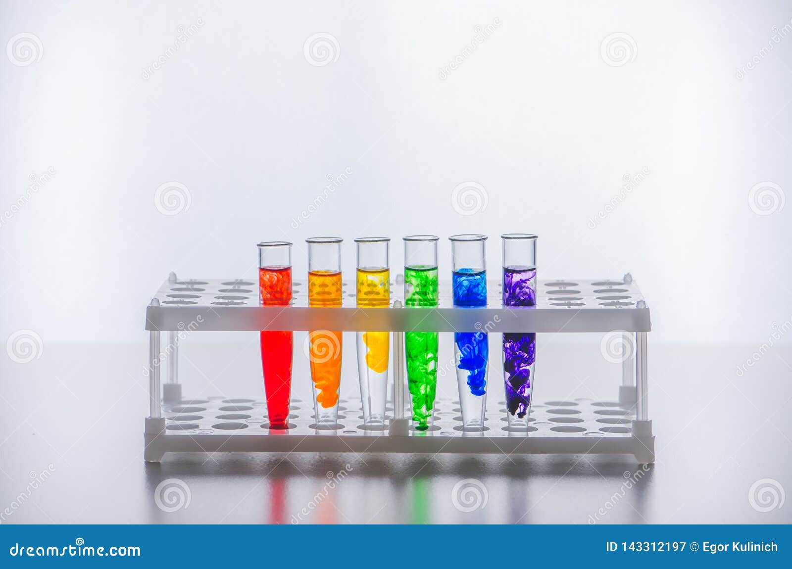 Glassware. Test Tubes with a Multi-colored Liquid. Chemical Reaction ...