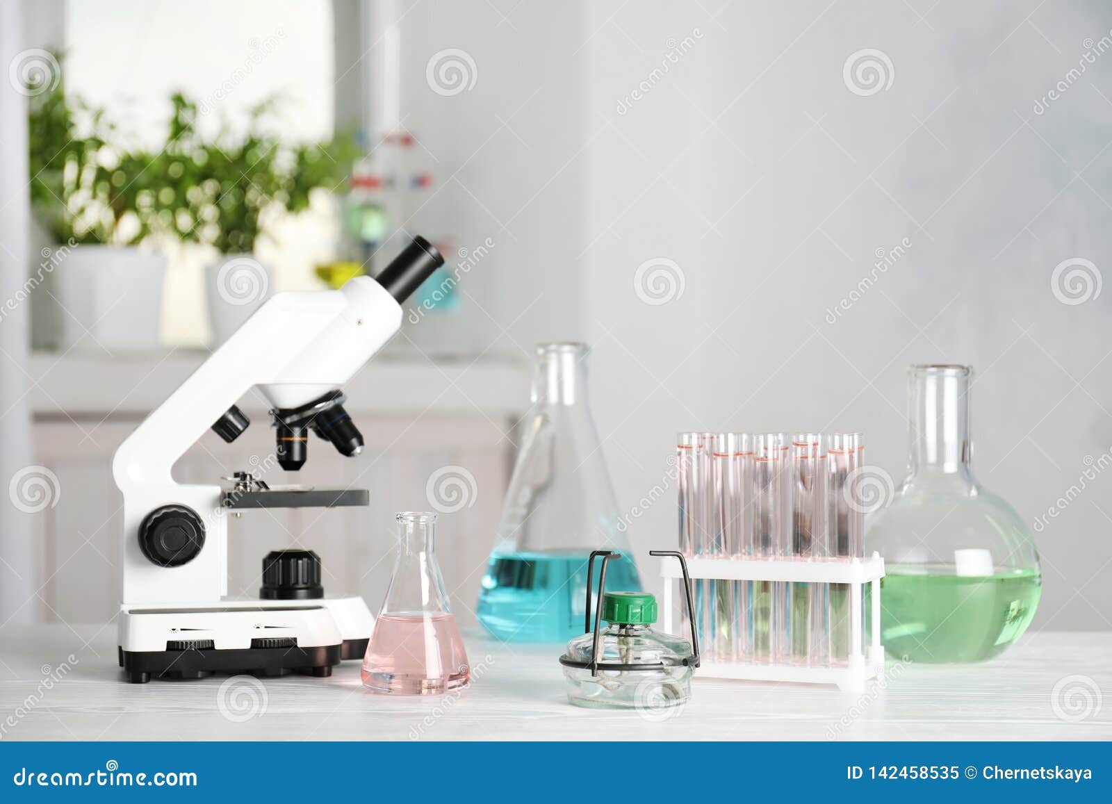 Laboratory Glassware and Microscope on Table. Chemistry Concept Stock ...
