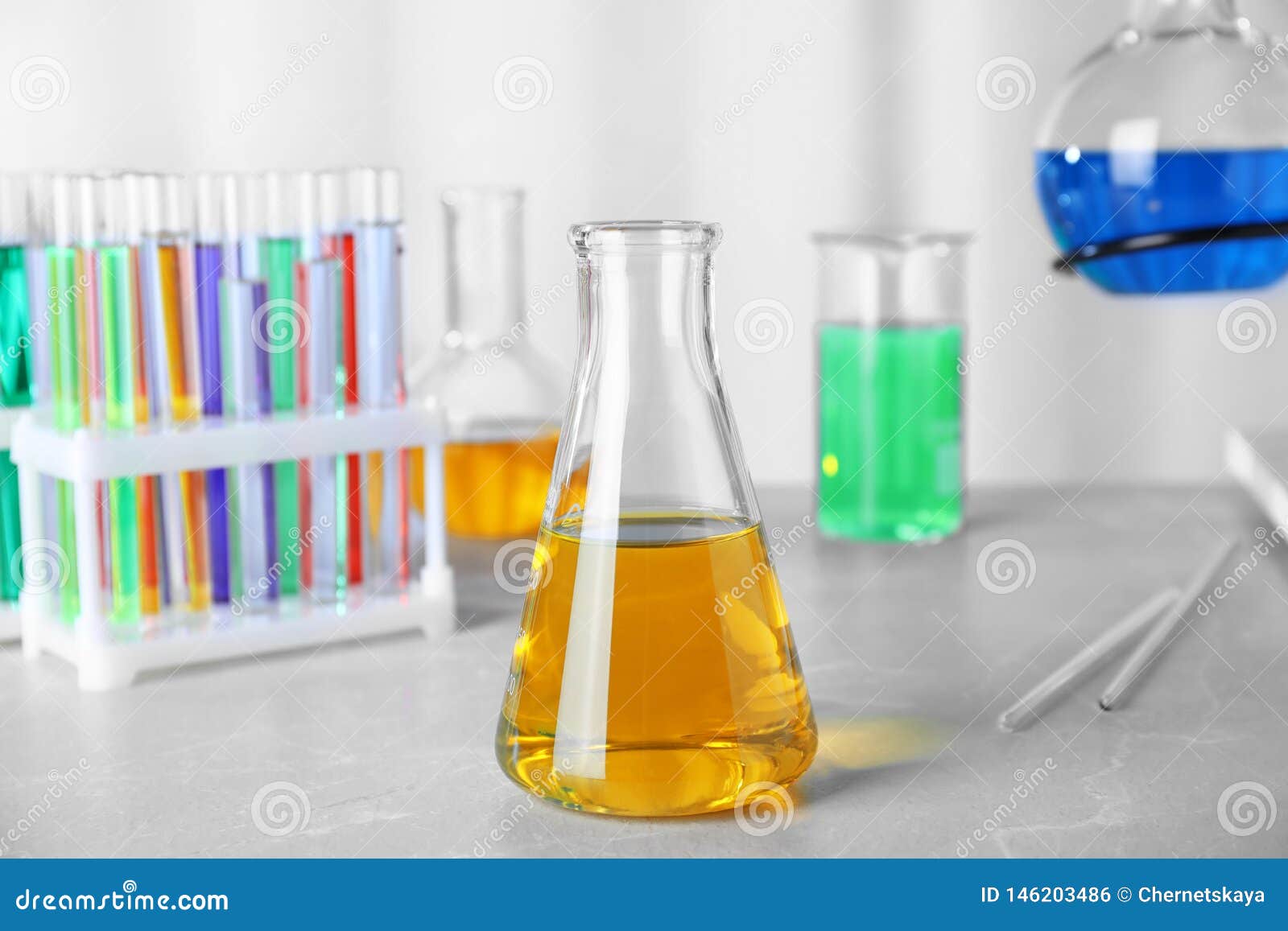 Laboratory Glassware with Samples on Table. Solution Chemistry Stock ...