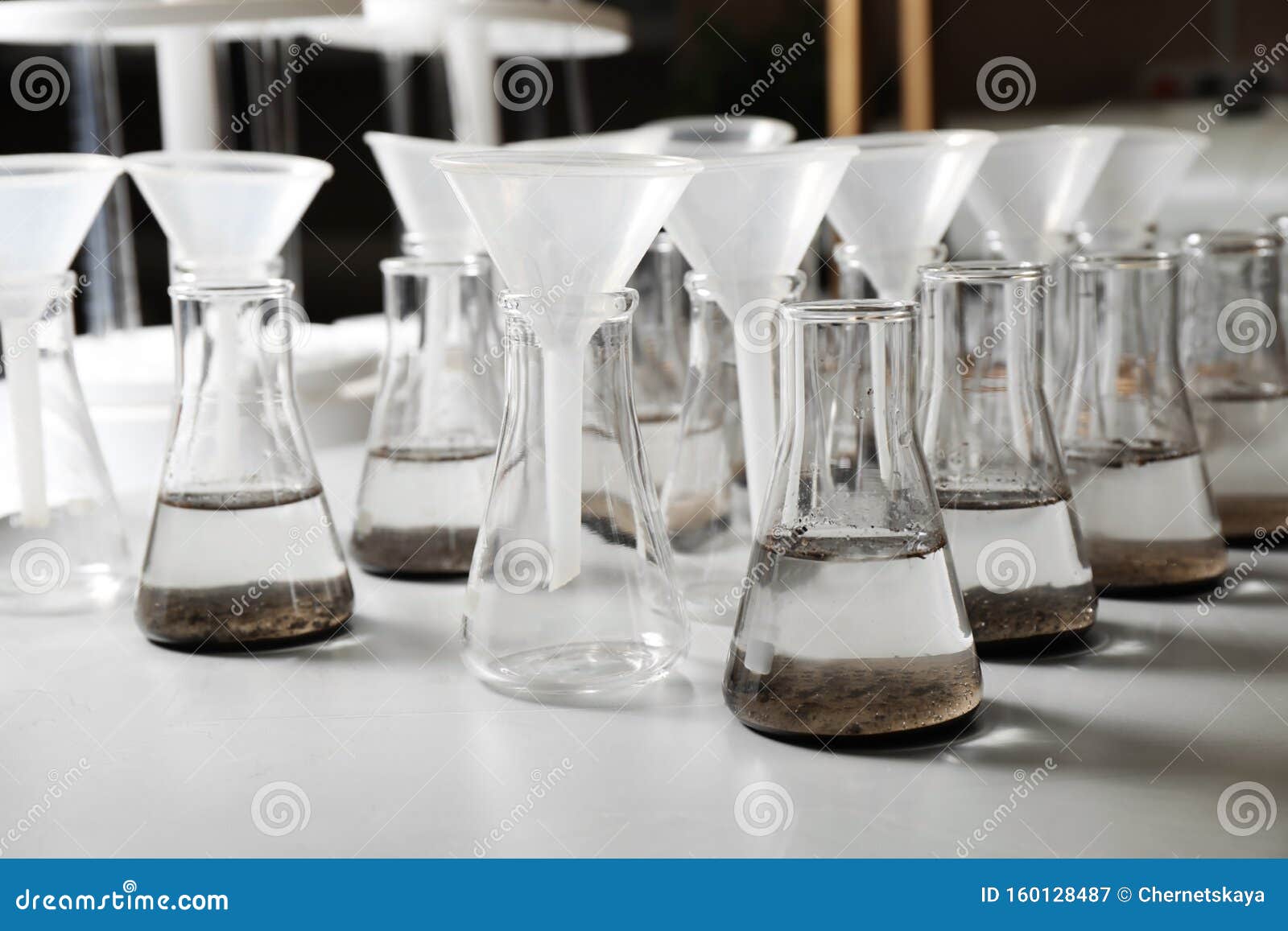 Laboratory Glassware with Soil Extracts and Funnels Stock Image - Image ...