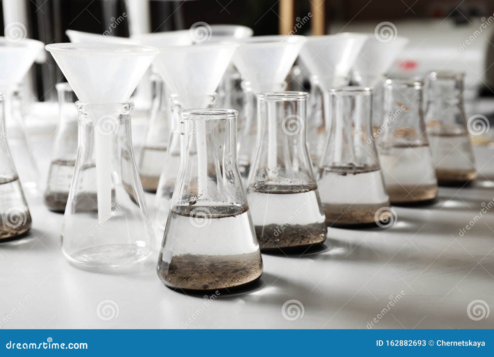 Laboratory Glassware with Soil Extracts and Funnels Stock Image - Image ...