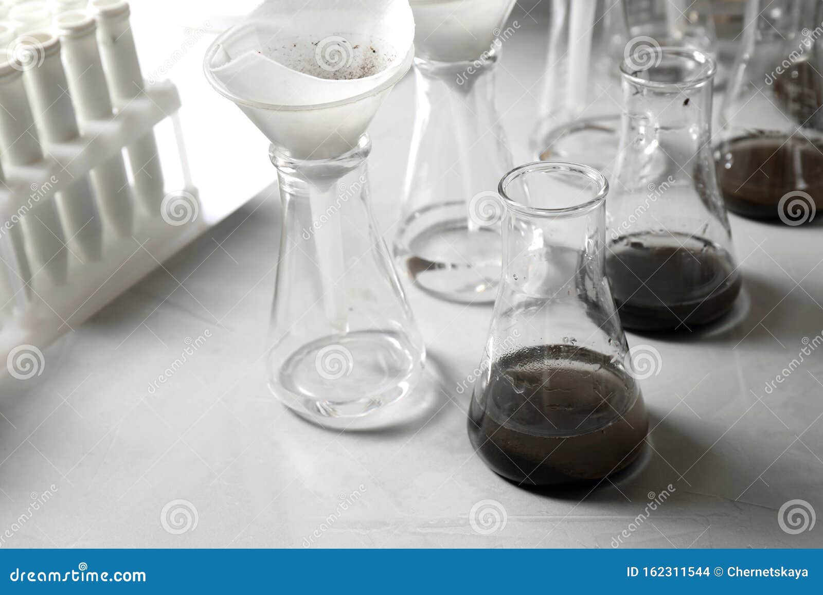 Laboratory Glassware with Soil Extracts and Funnels Stock Photo - Image ...