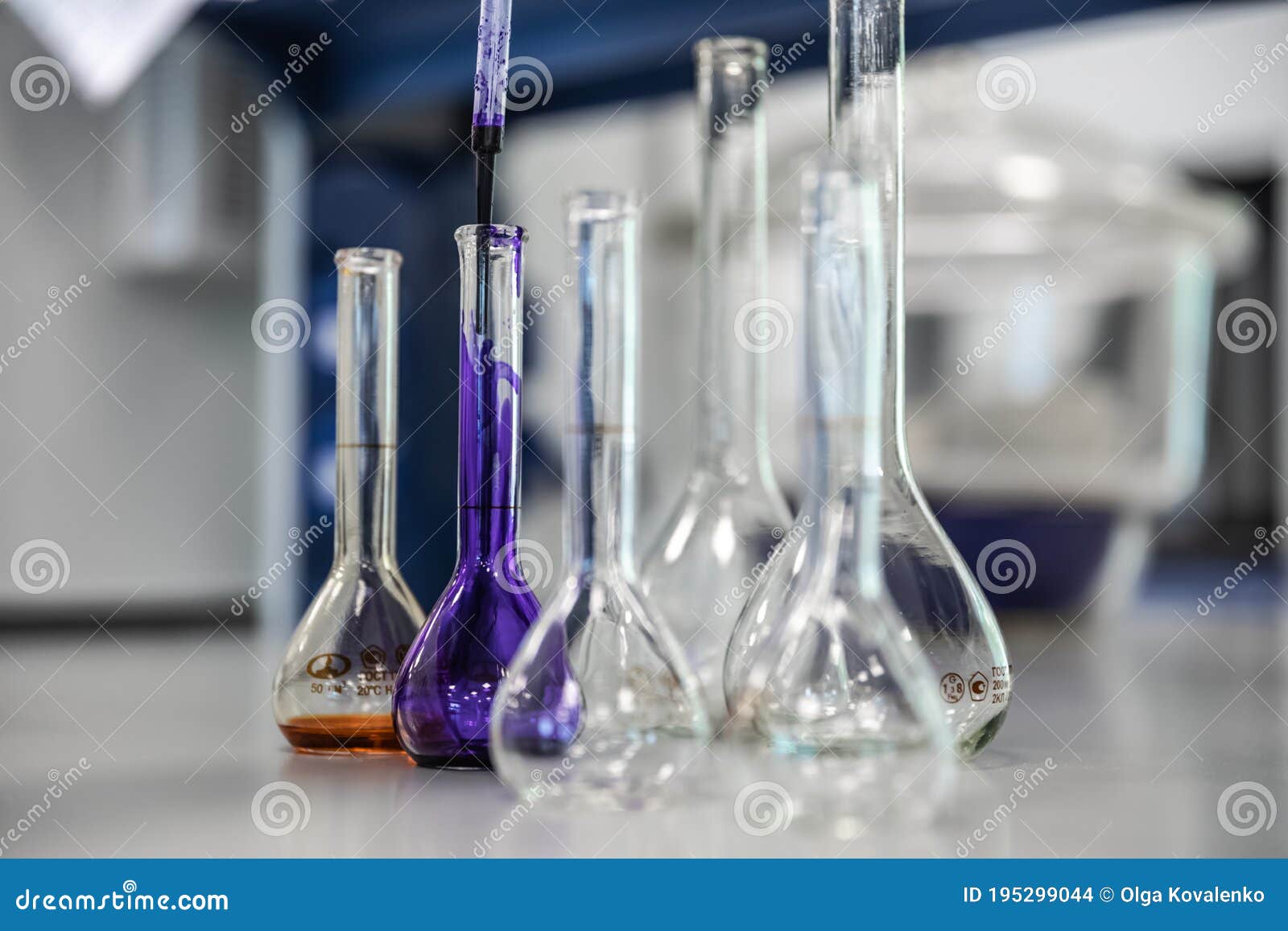 Laboratory Glassware with Various Colored Liquids with Reflection on ...