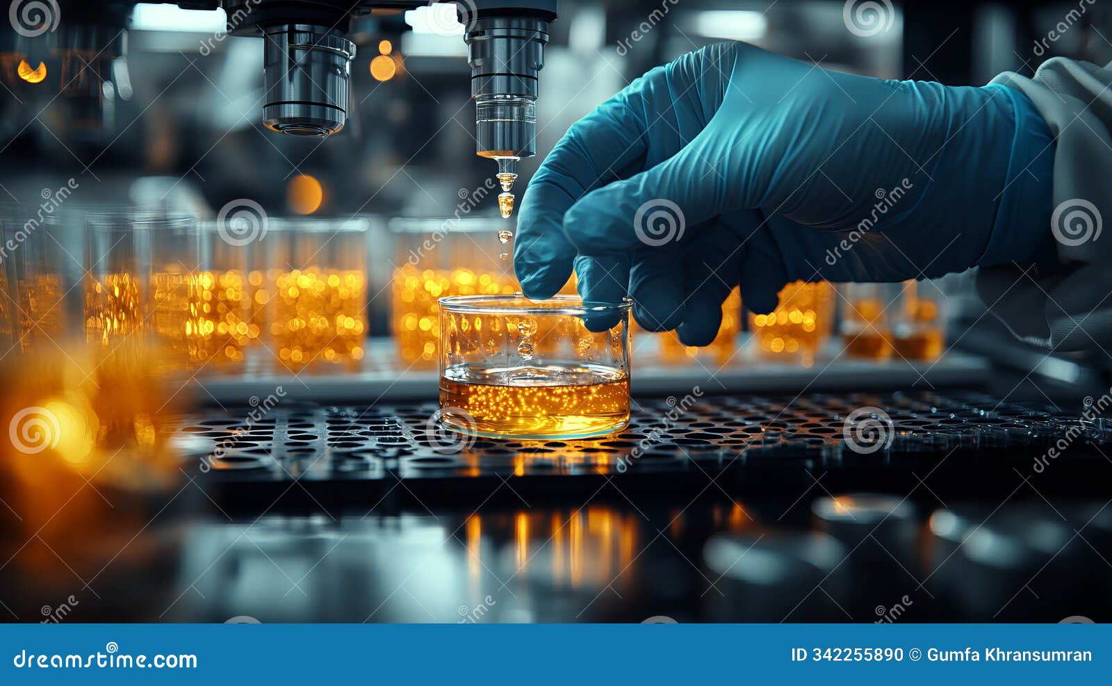 Laboratory Hand Pouring Liquid into Beaker with Orange Solution ...