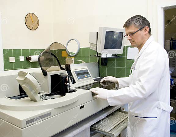 Laboratory man and machine stock photo. Image of detail - 2335412
